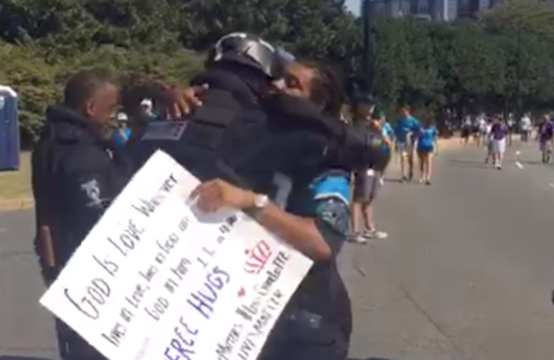 Charlotte protesters give police hugs, explain their cause | Raleigh ...