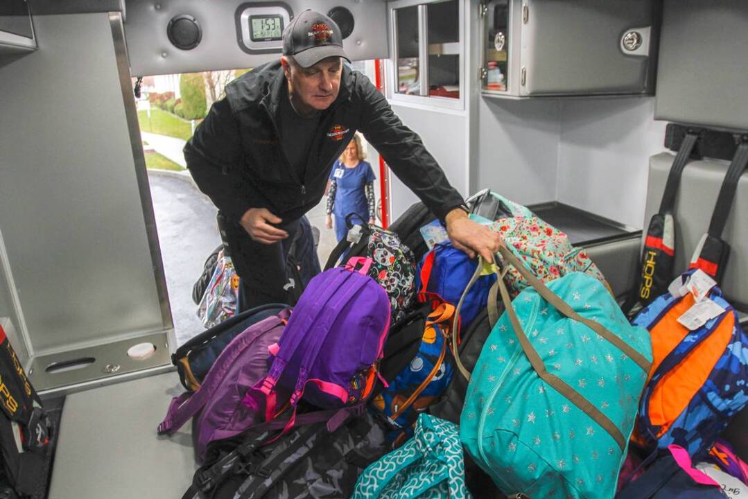 Packing up backpacks for local foster kids | Fort Worth Star-Telegram