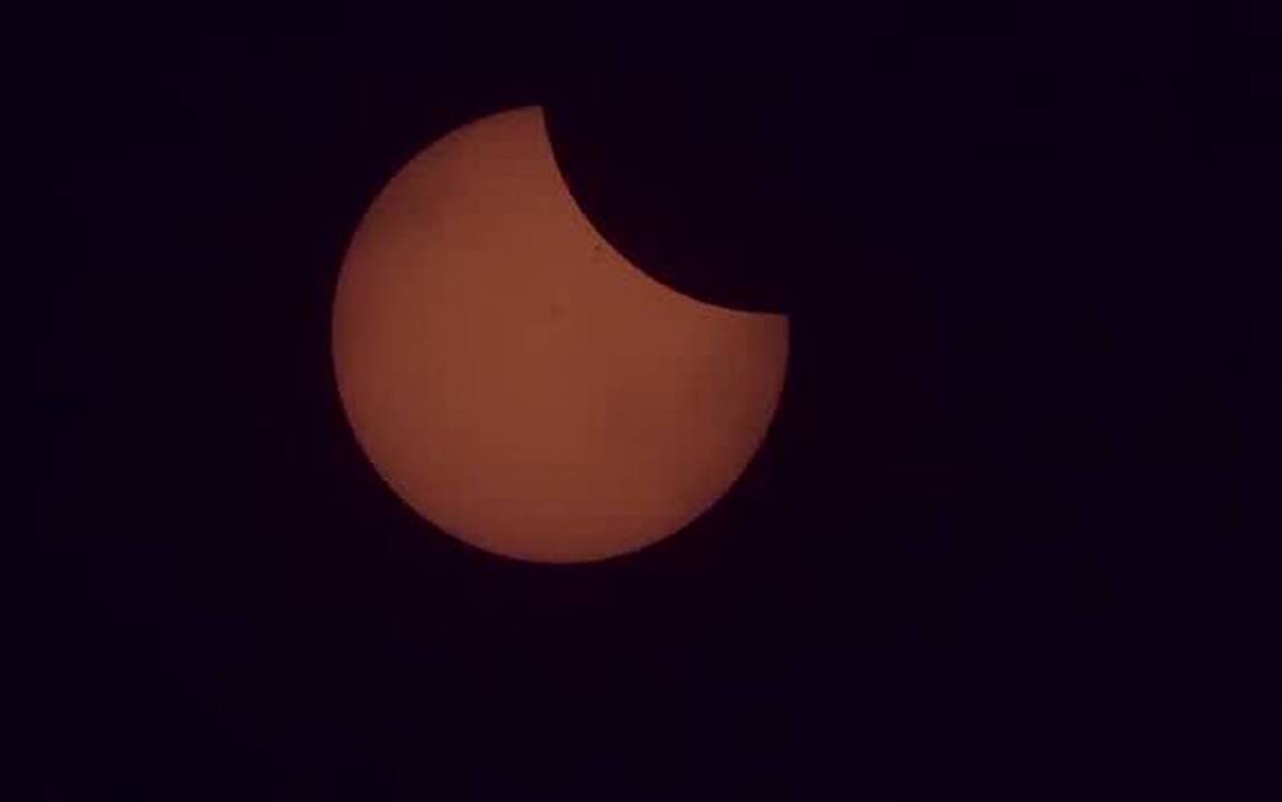 ISS streaks across partial solar eclipse | Charlotte Observer