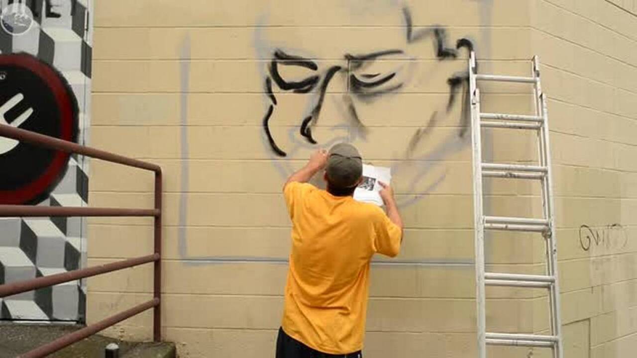 Bellingham artist demonstrates his mural painting technique in downtown ...