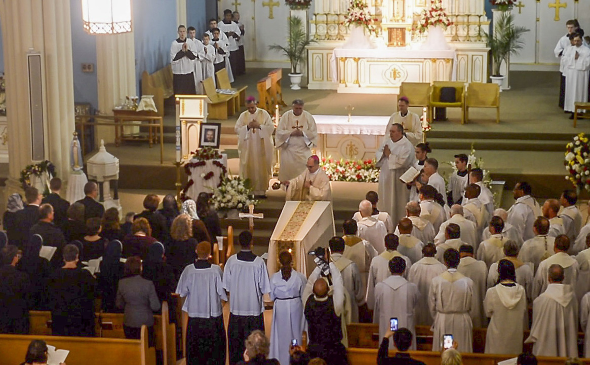 A funeral mass for Rev. Michael Wagner over-filled Holy Rosary Catholic ...