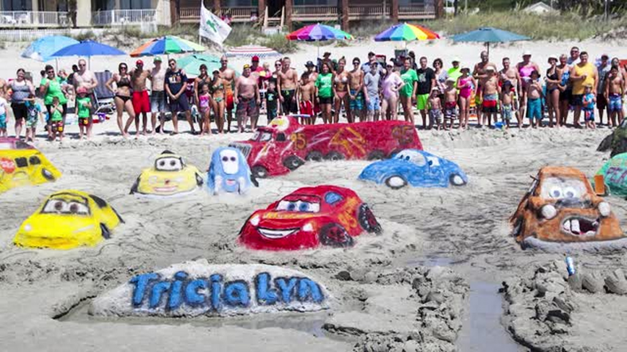 Long-time vacationers decorate beach with Disney themed sandcastles ...