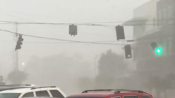 Traffic lights swing back and forth during severe storm | AccuWeather