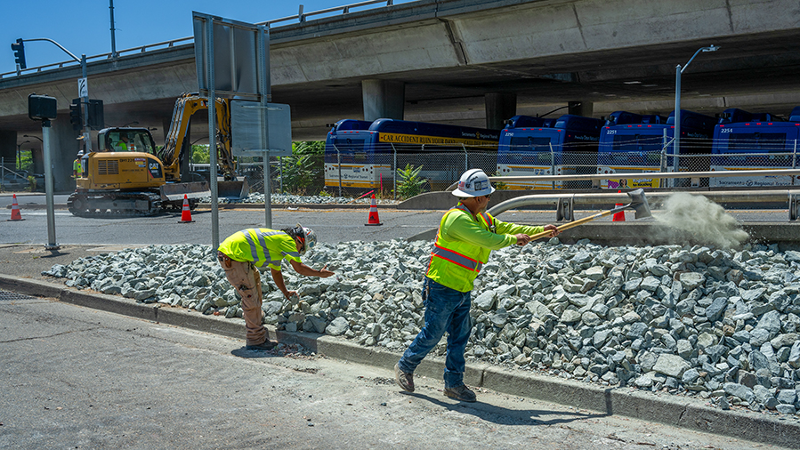 Caltrans workers place rocks near overpass in Midtown | Sacramento Bee
