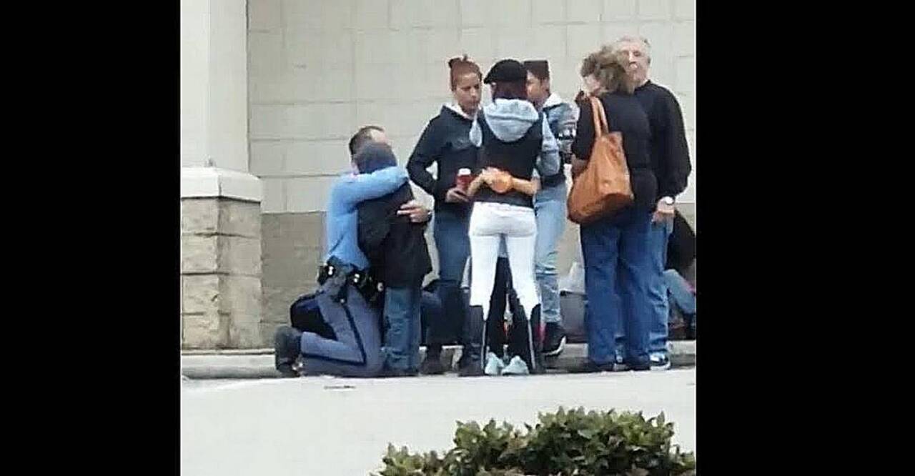 Police officer hugs boy: Video of Raleigh cop hugging boy goes viral ...