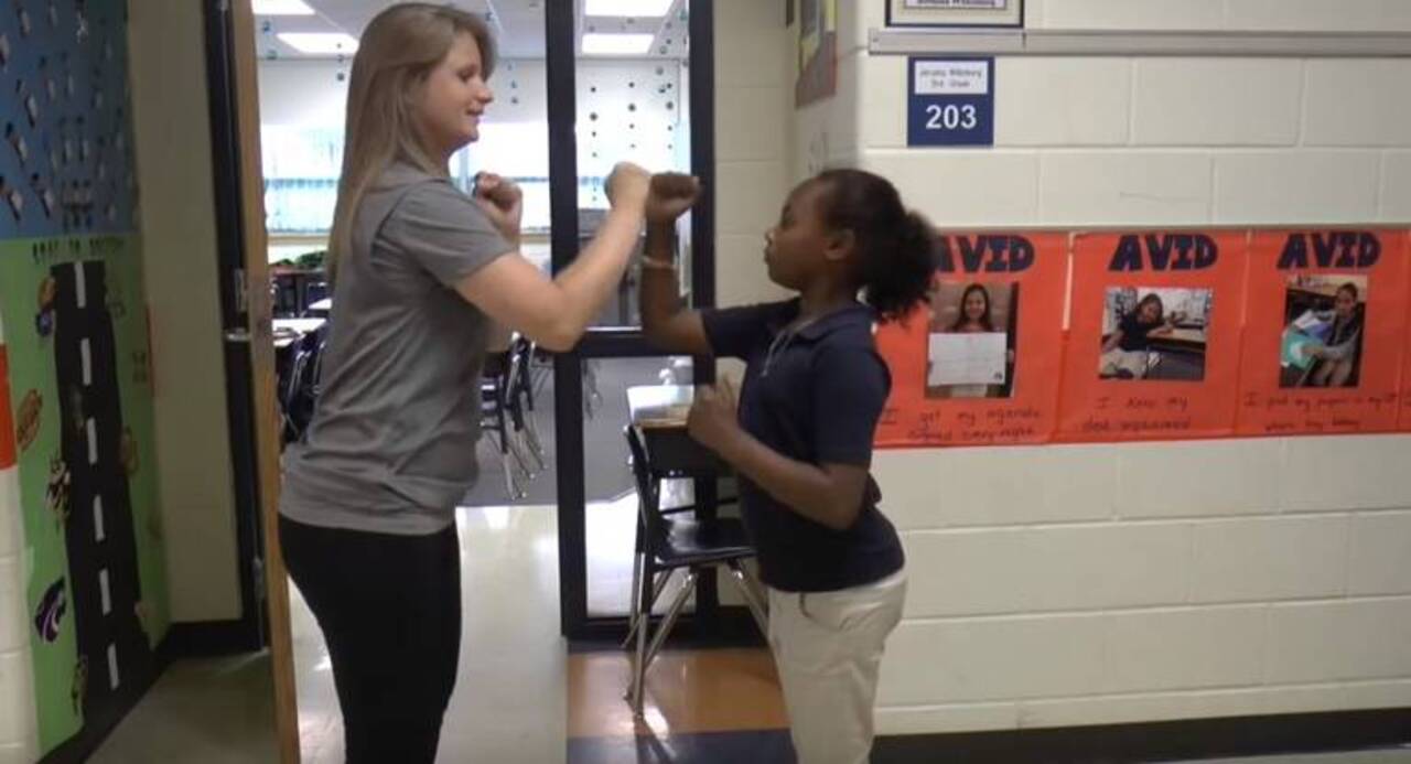 Jerusha Willenborg, a third-grade teacher at Gordon Parks Academy in Wichita, starts and ends ...