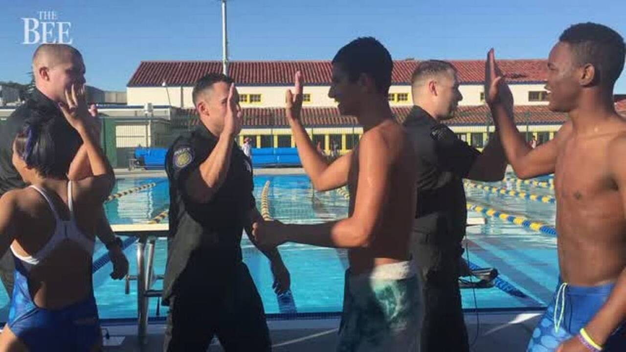Watch Sacramento police officers swimming in full uniform, take on ...