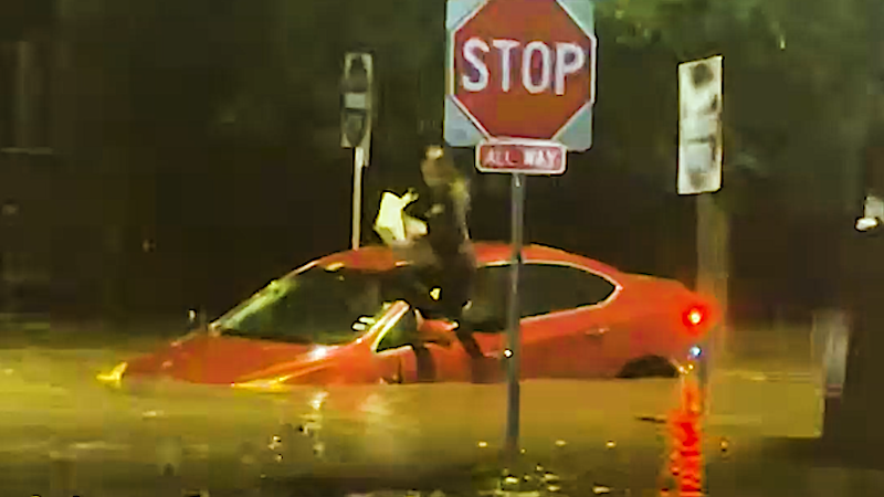 Woman climbs onto car roof to escape floodwaters in Fort Worth ...