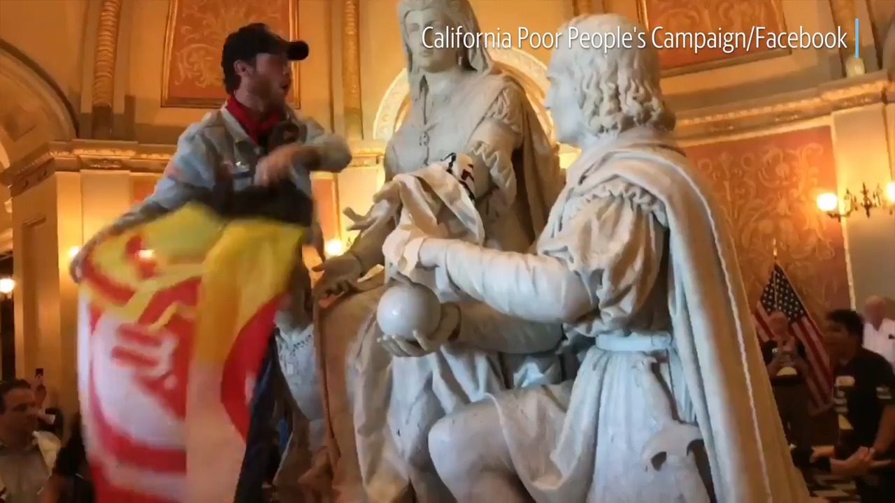 Protesters of Christopher Columbus 'genocide' climb statue, get ...