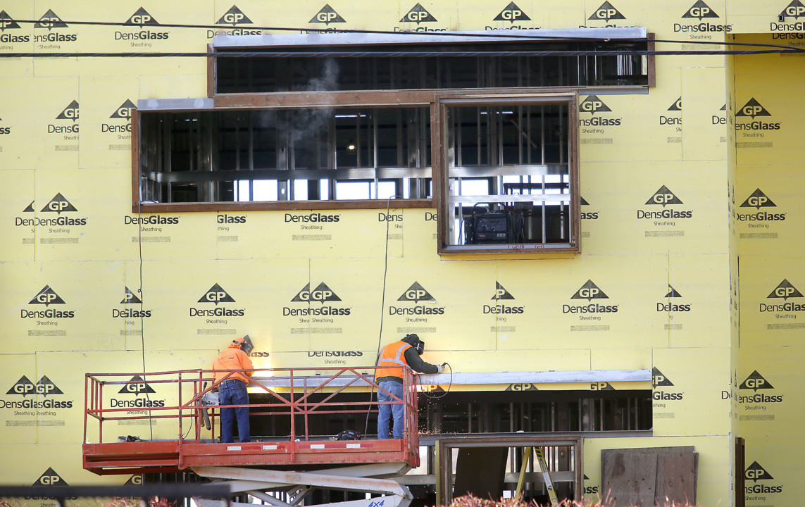 Construction crews working in Sept. 2019 on the new 20-classroom ...