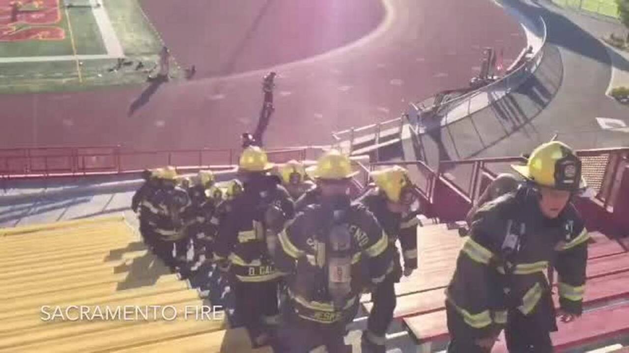Sacramento Fire Academy class climbs stairs at Hughes Stadium in full ...